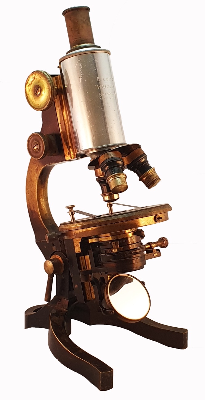 A close-up of a microscopeDescription automatically generated with low ...